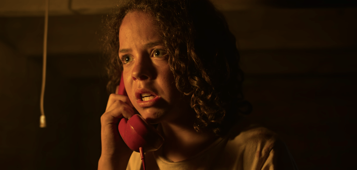 Boy Swallows Universe: Who Does Eli Talk to on the Red Phone?